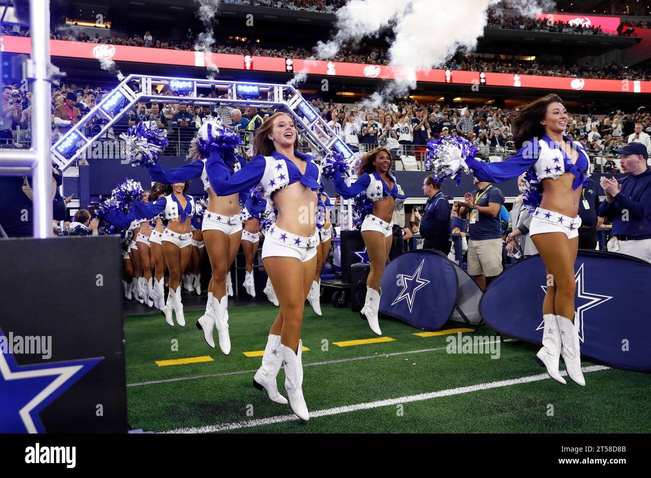 The Dallas Cowboys Cheerleaders enter the field before an NFL football ...