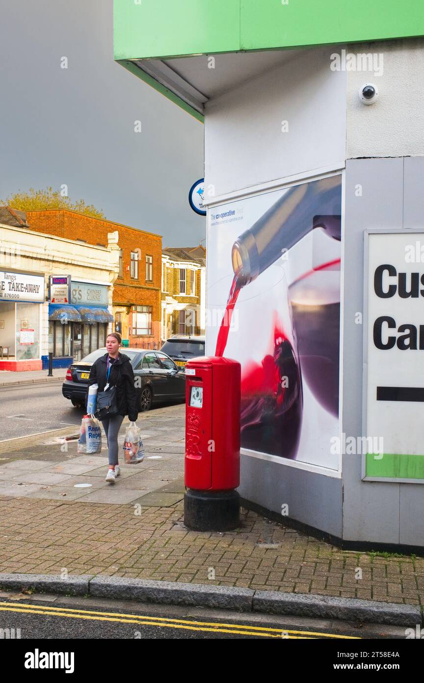 Red wine on a poster being poured into red post box Stock Photo - Alamy