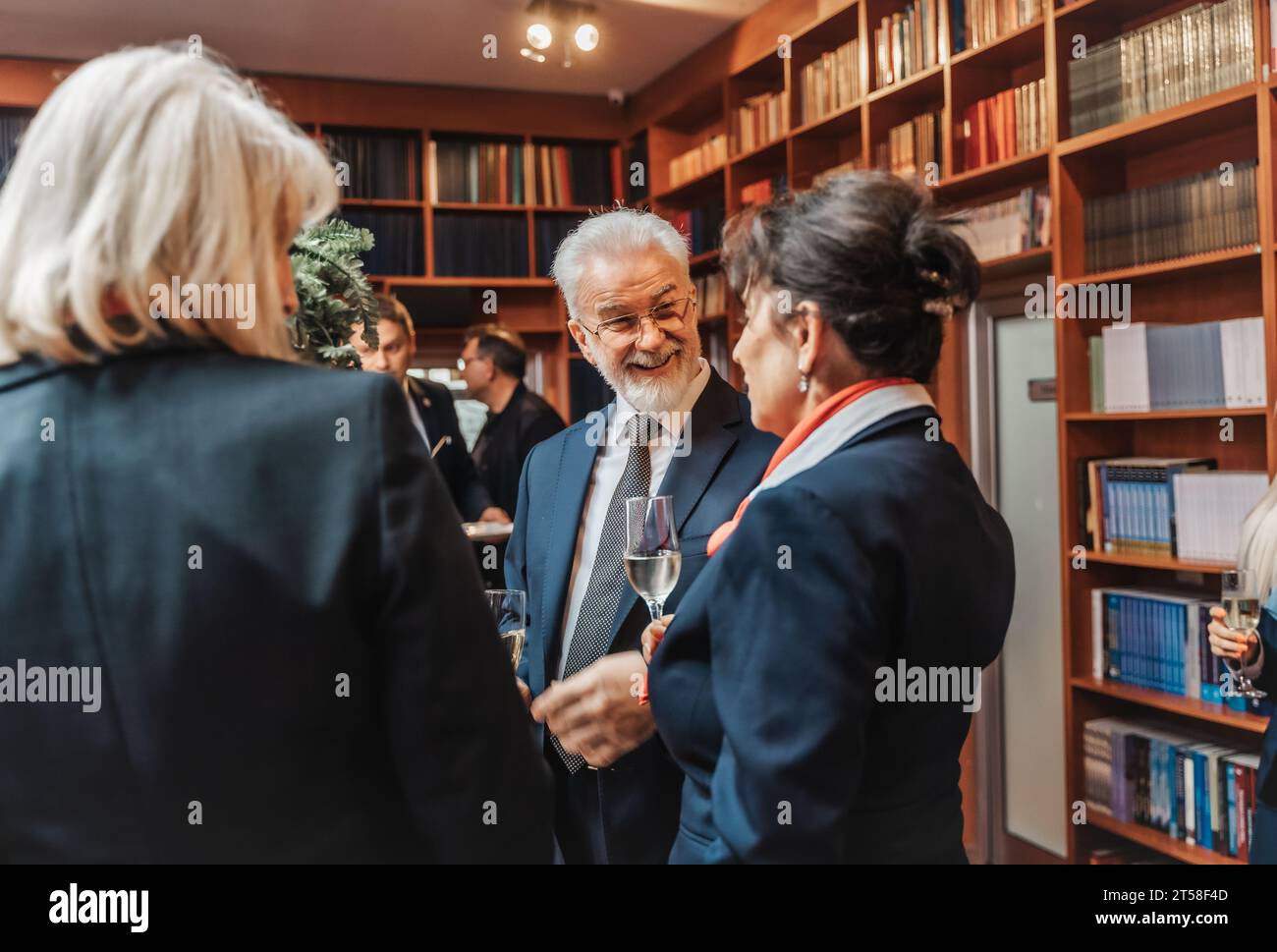 A diverse business team celebrates achievements and success at a ...