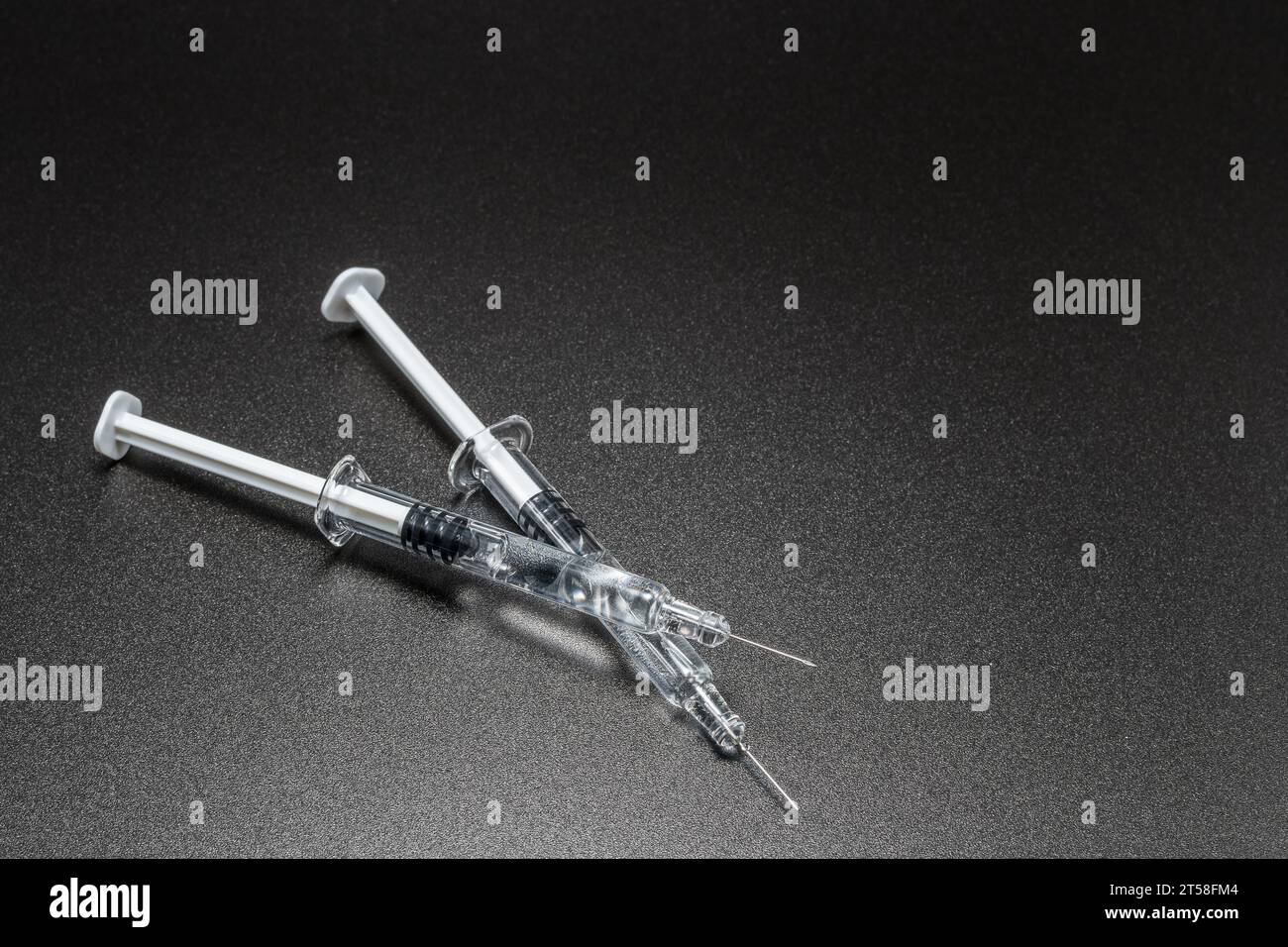 Medical syringes and needles on black background. Medical concept ...