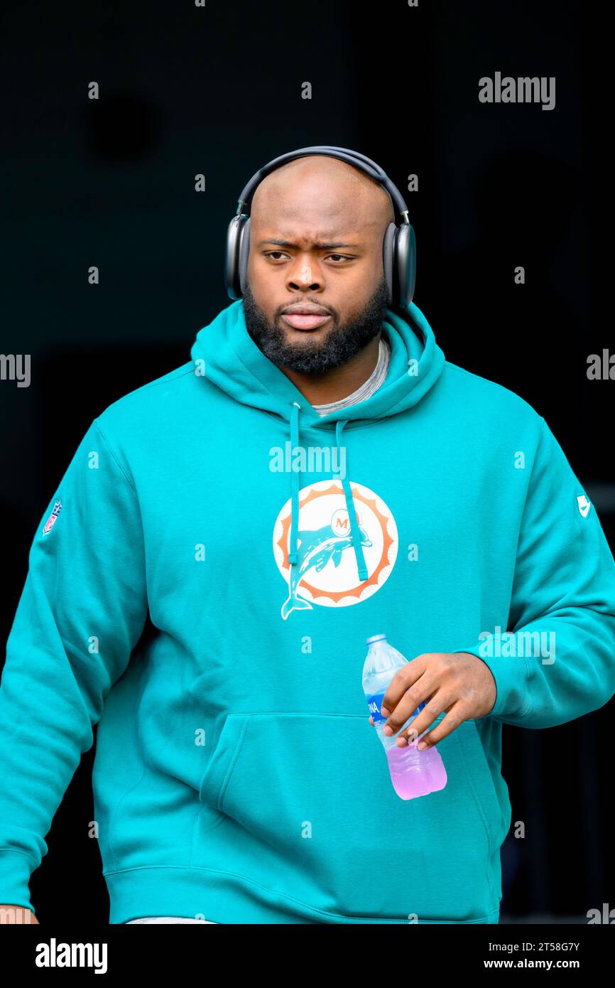 Miami Dolphins offensive lineman Robert Jones (65) walks onto the field ...