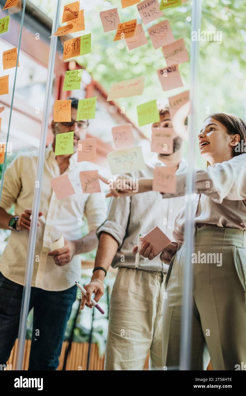 Diverse professionals collaborate and strategize in a modern office ...