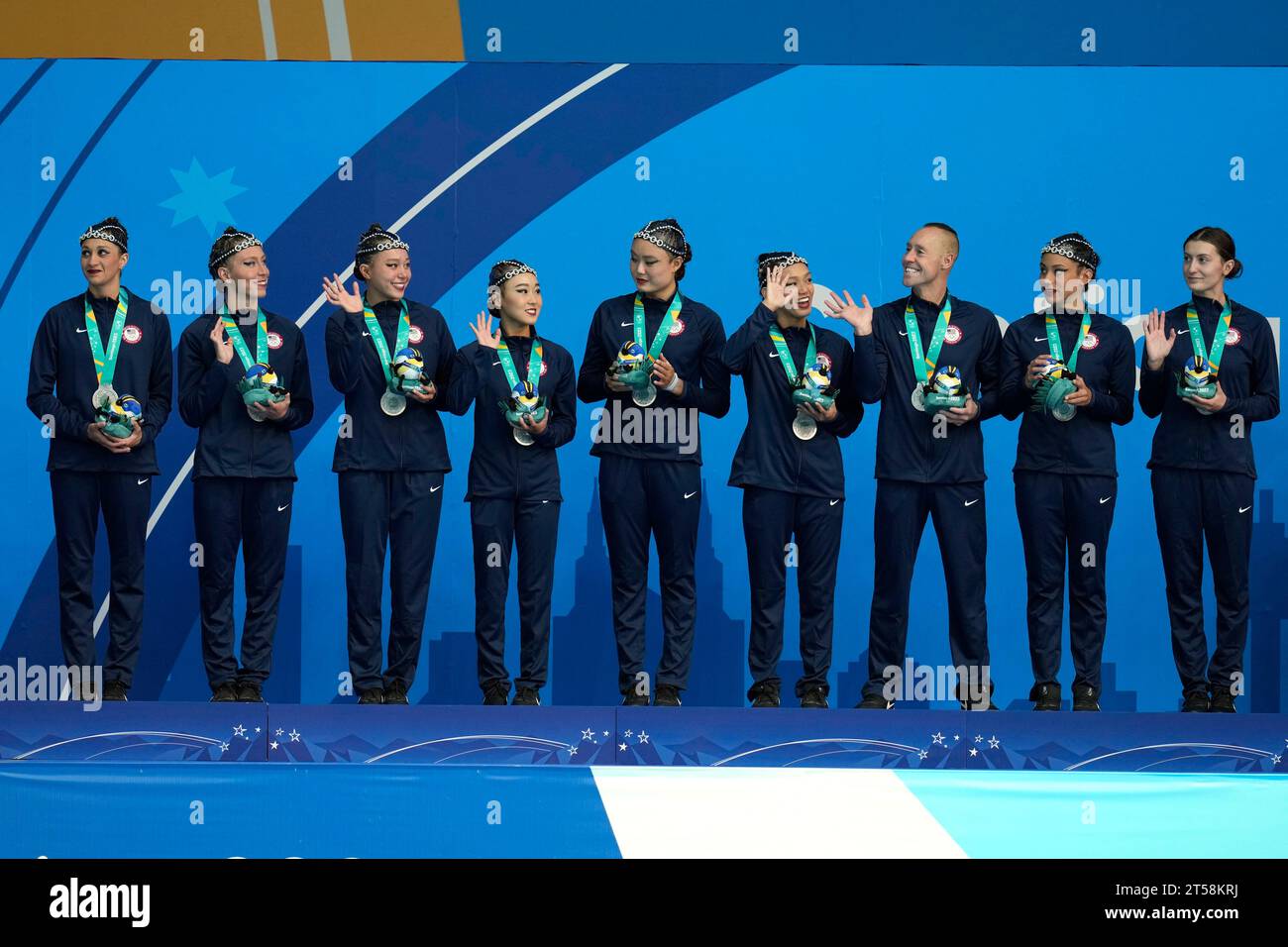 The United States team poses with their silver medals for the artistic ...
