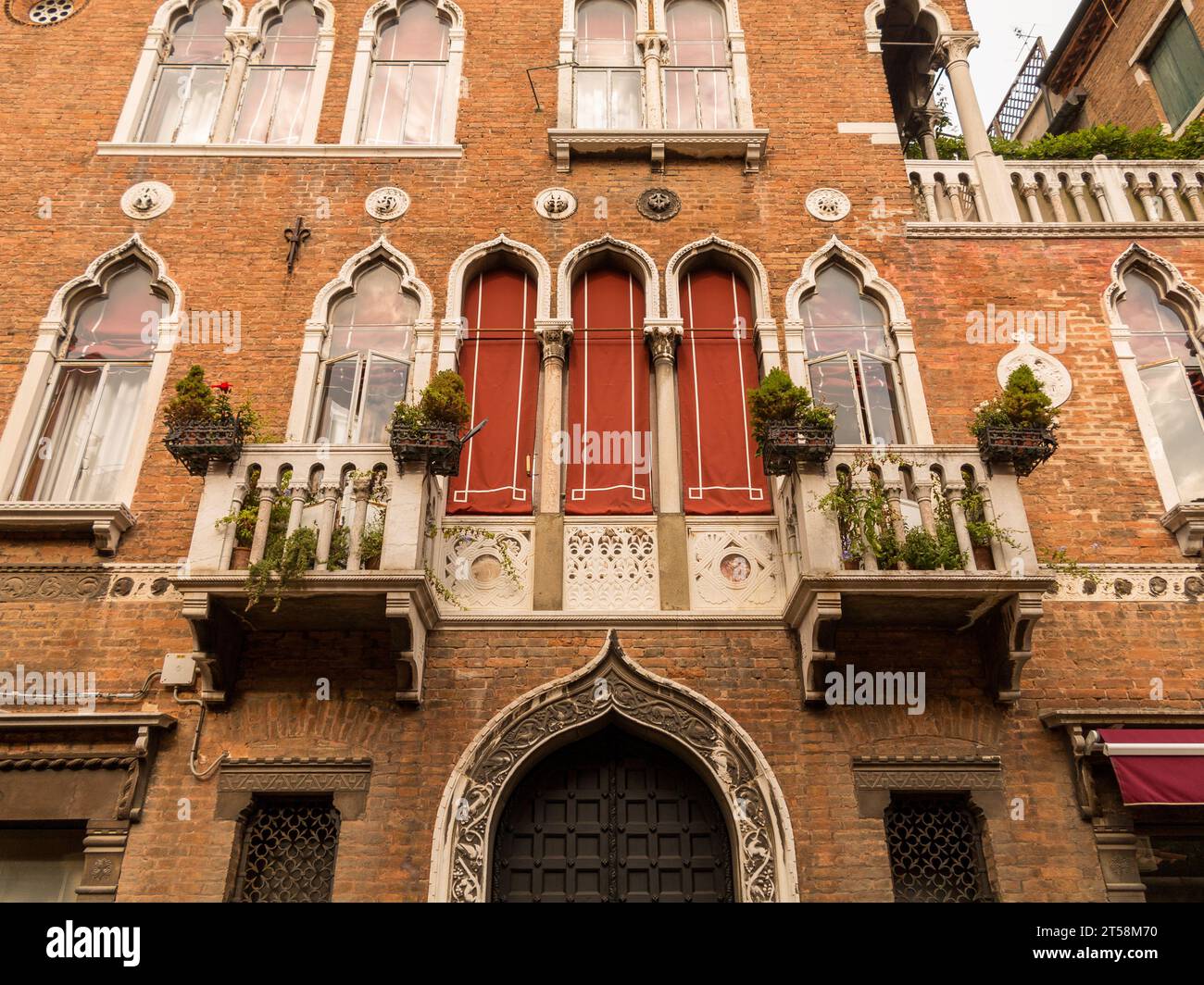 Facade of a Venetian villa richly decorated with balconies, arcades ...