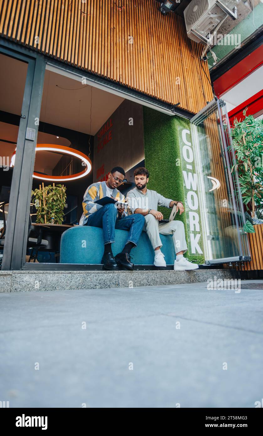 Multiracial colleagues working together to solve problems and drive ...