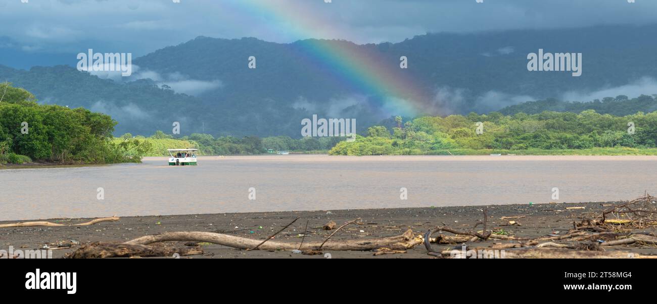 Rainbow over the Tarcoles River estuary after a tropical rain shower in ...