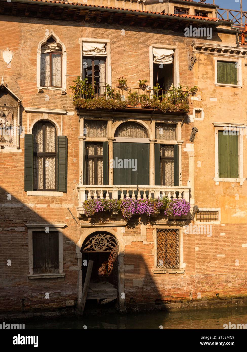 Venetian villa on the edge of a canal in Venice, Italy. The balconies ...
