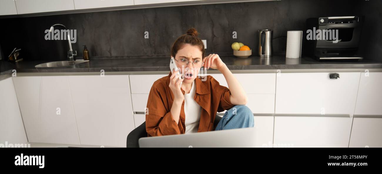 Portrait of woman with shocked face, receives concerning bad news over ...