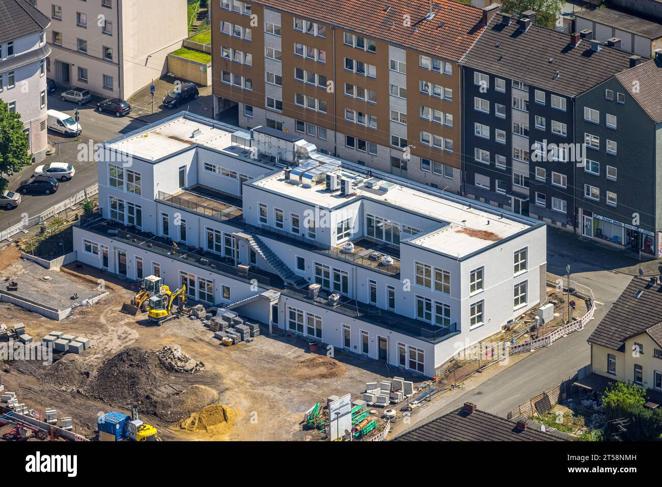 Aerial view, construction site at Terra 1 with new building for school and kindergarten between ...