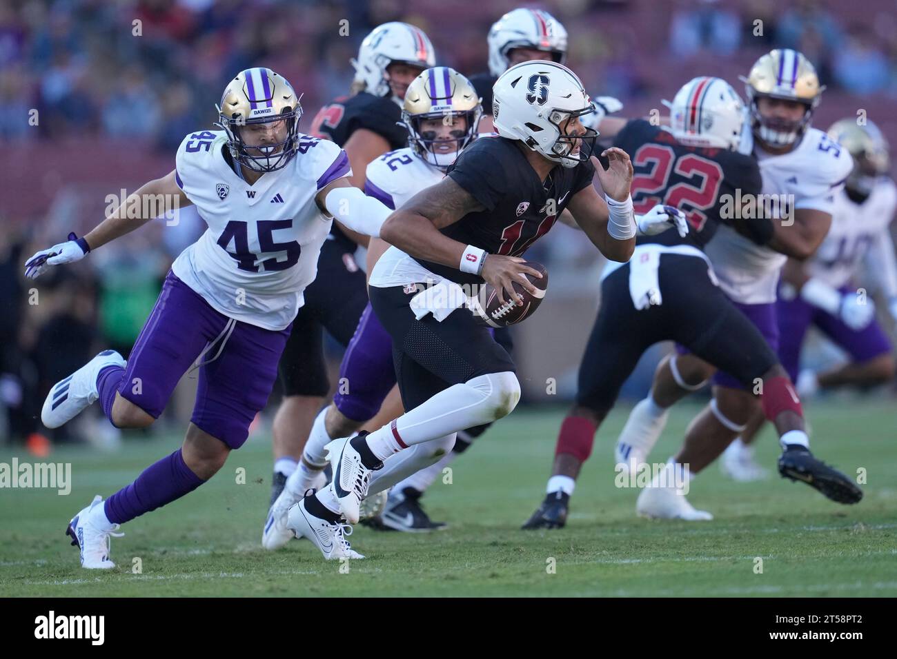 Stanford quarterback Ashton Daniels, foreground, scrambles from ...