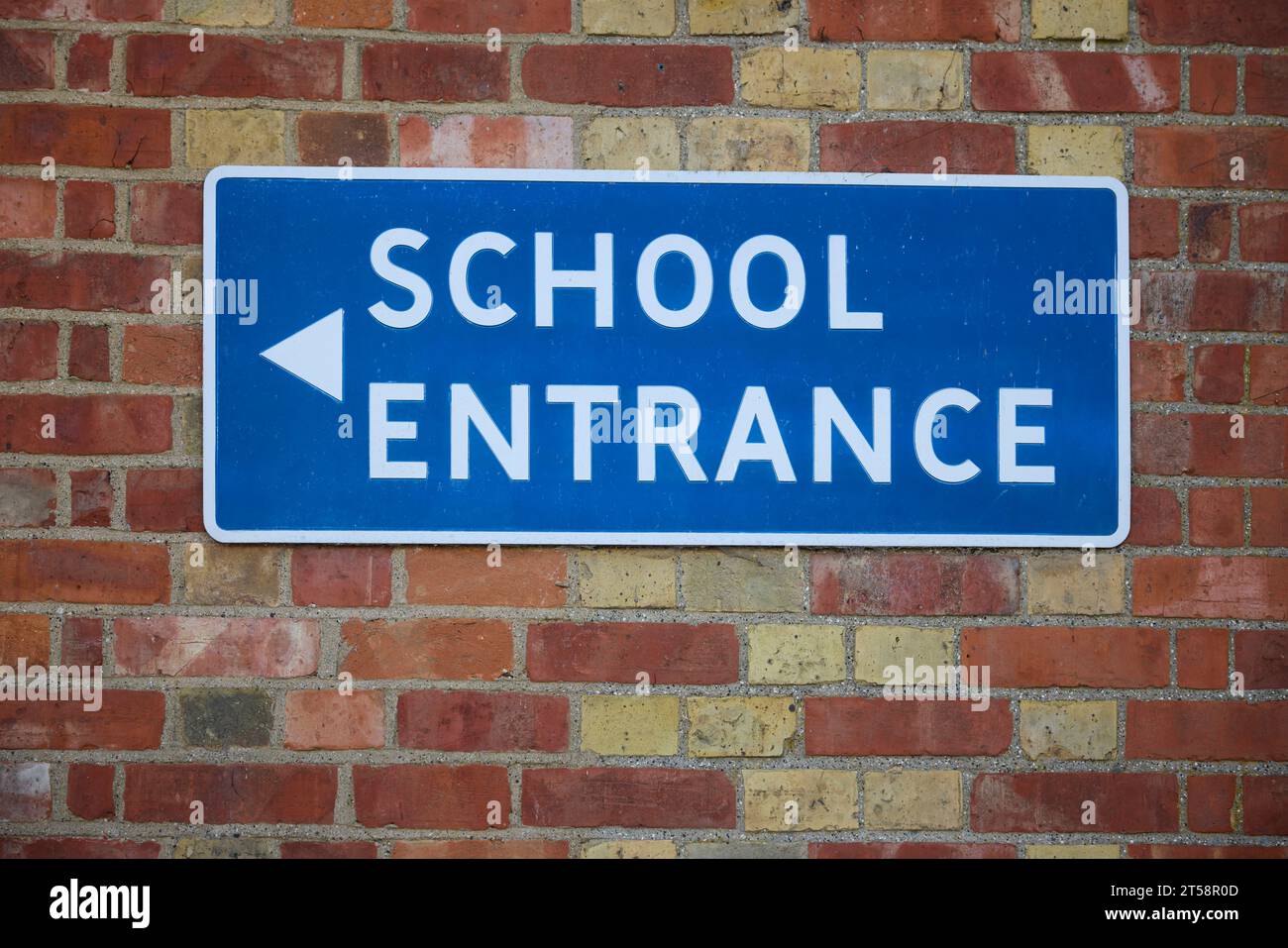 School Entrance Sign On Brick Wall Of School Building Stock Photo - Alamy