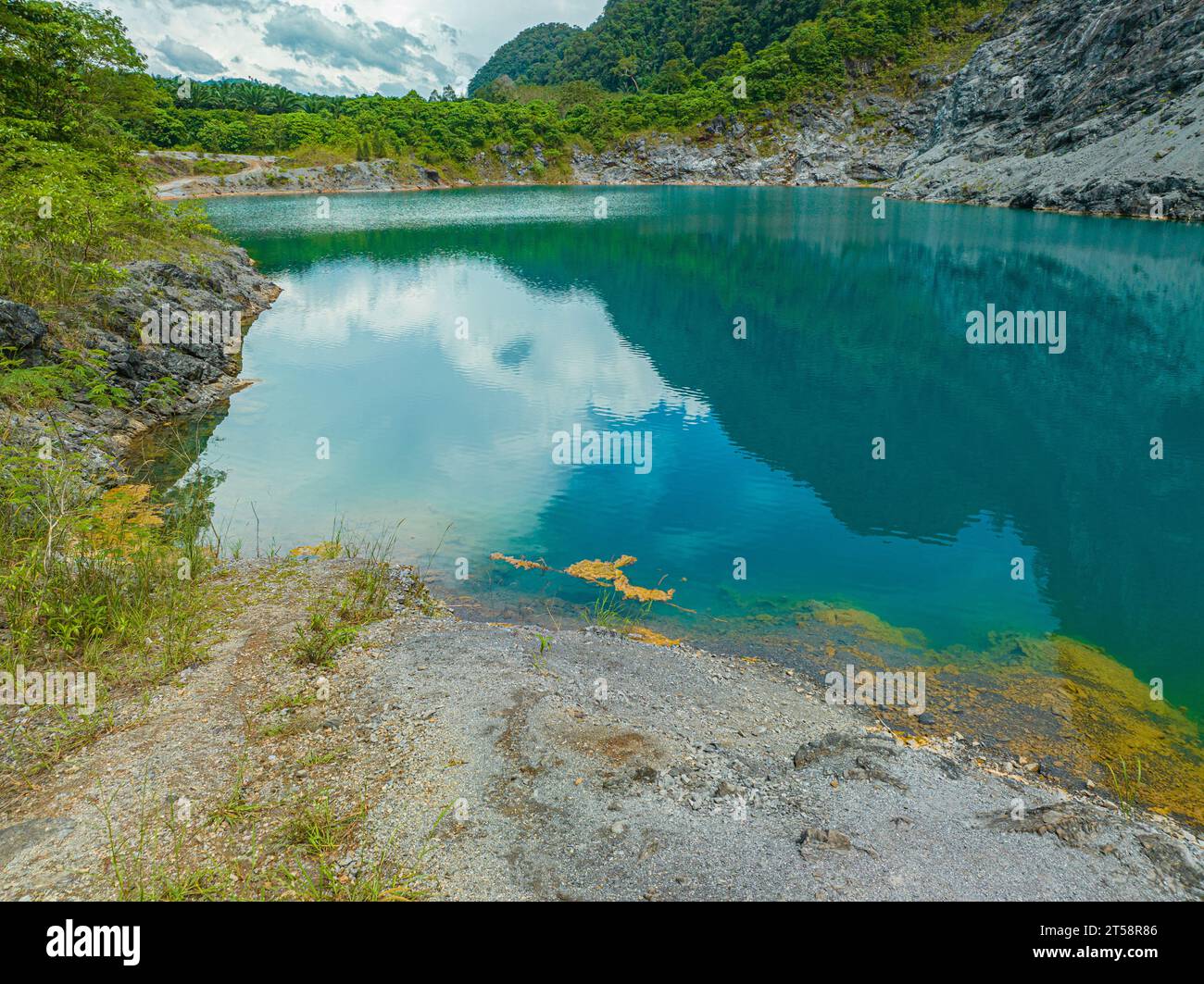 Aerial view beautiful The reflection of the blue sky in the emerald green pond. Emerald green ...