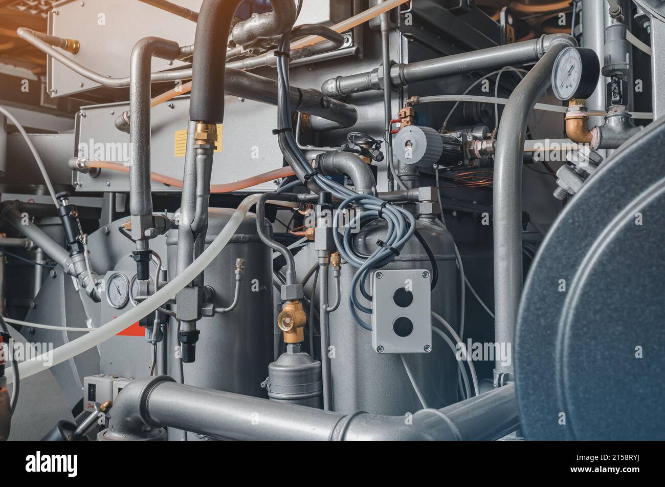 Pressure gauges and hoses on back of industrial equipment. Connection ...