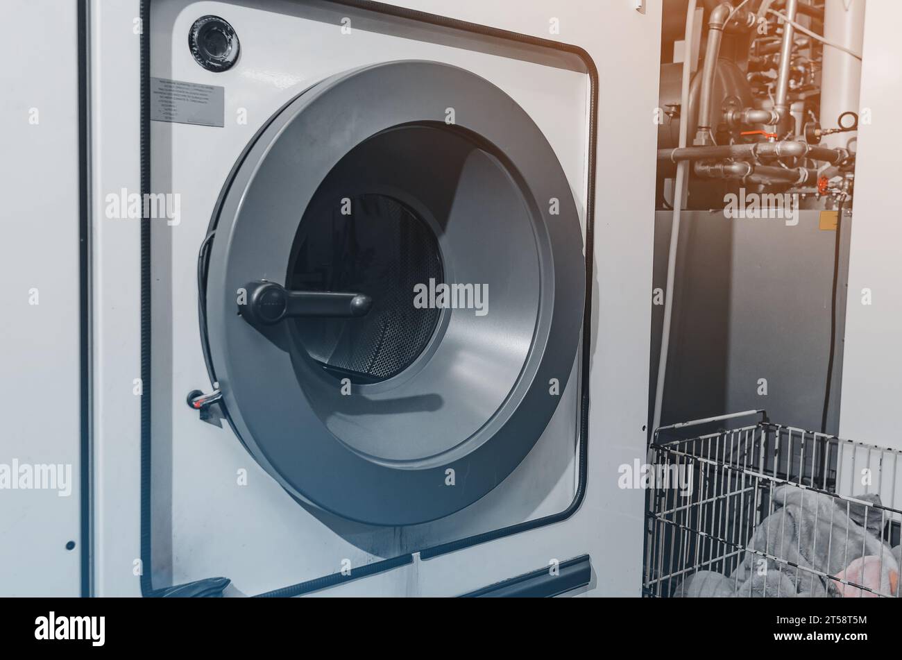 Automatic washing machine in dry cleaning room. Side view of washing ...