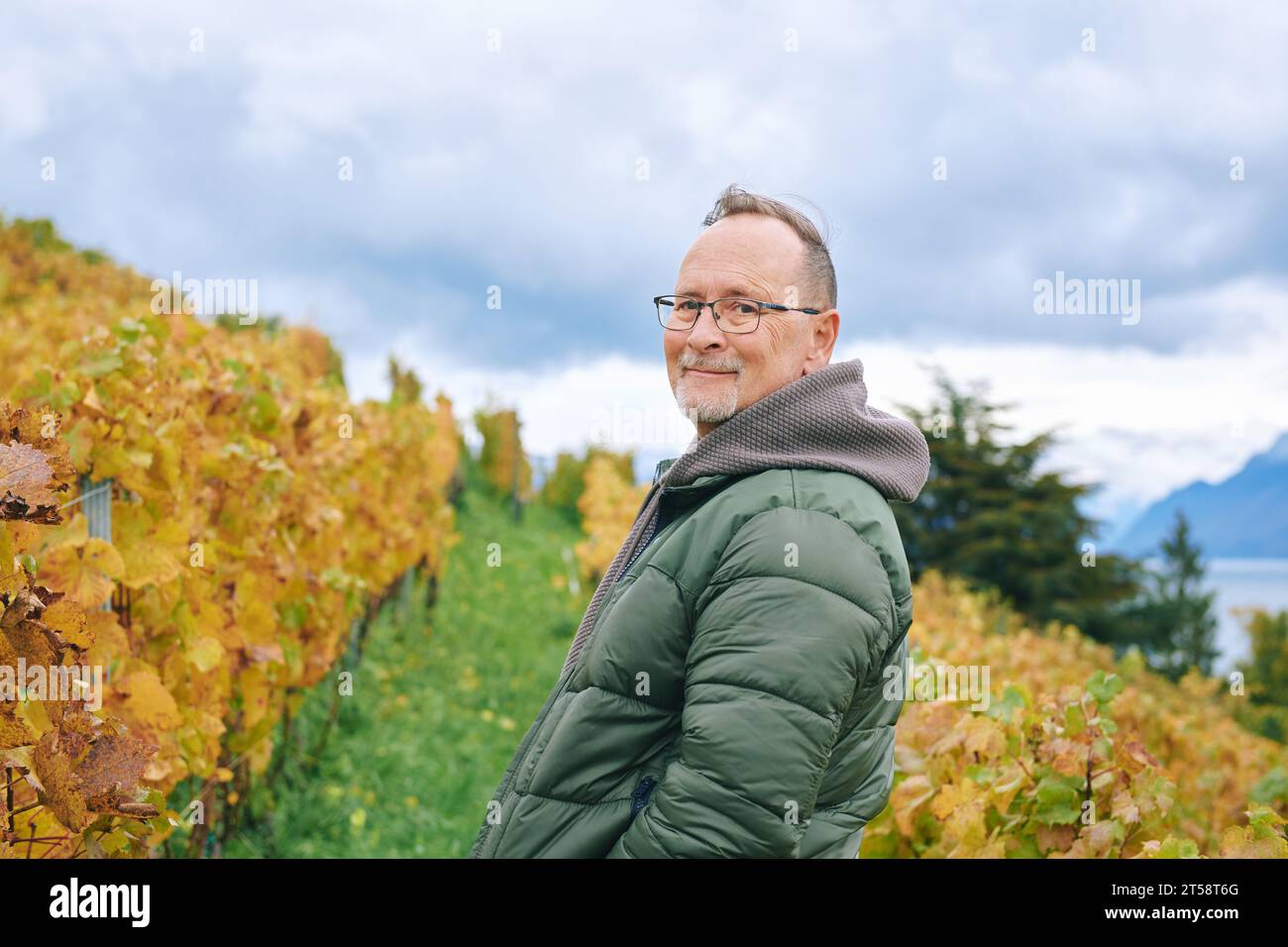 Outdoor portrait of middle age 55 - 60 year old man enjoing nice autumn ...