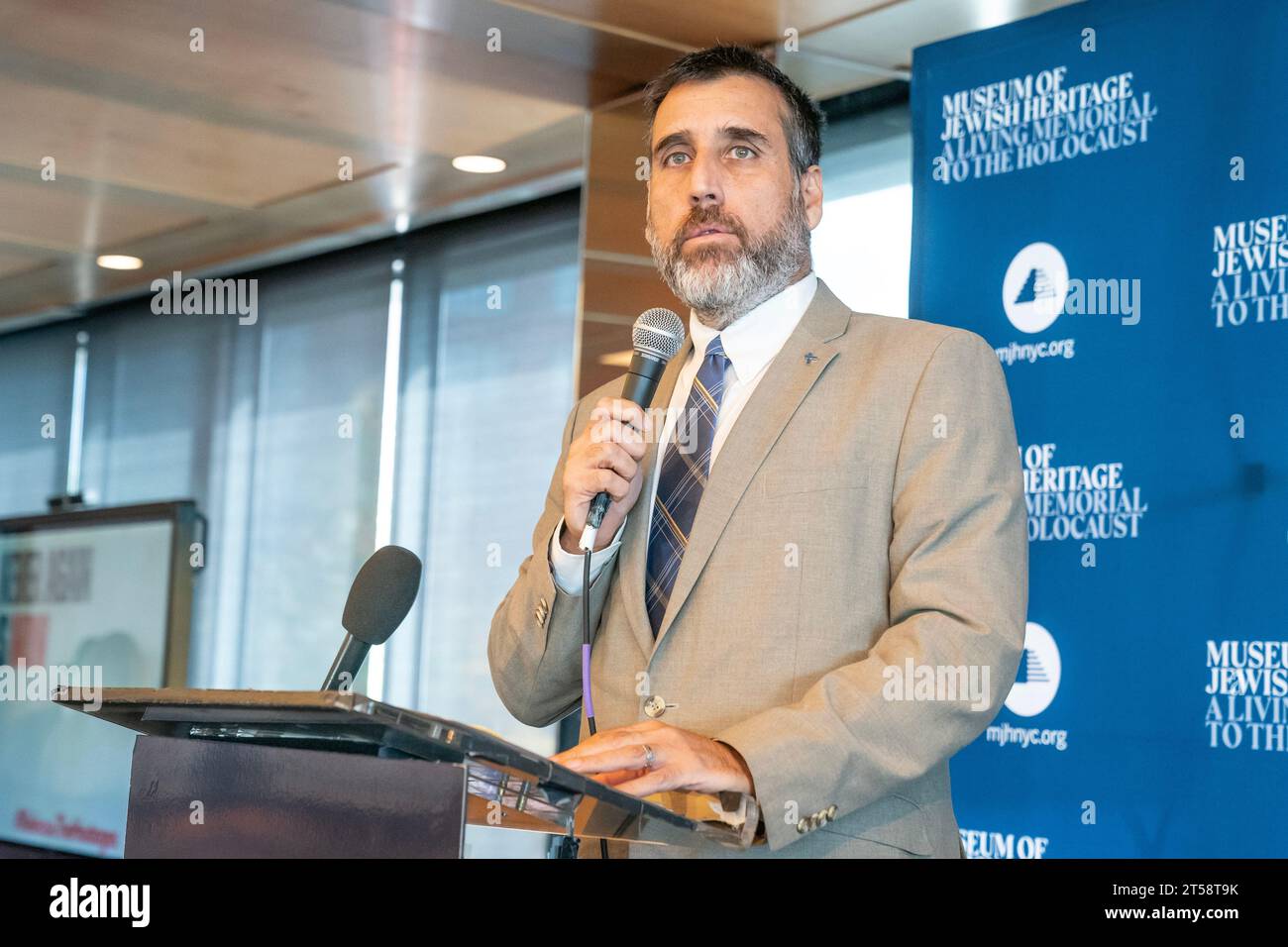 Deputy head of Mashav speaks during rally of 240 Holocaust survivors ...