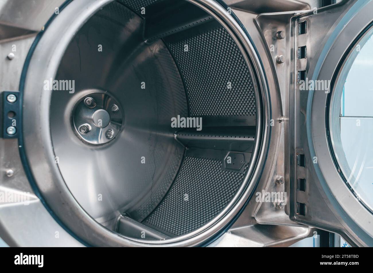 Shiny dryer close-up. High-quality photo of drying drum in dry cleaner ...