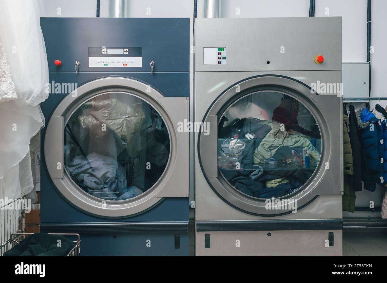 Front view of dry cleaning dryer. The dry cleaners have two dryers ...