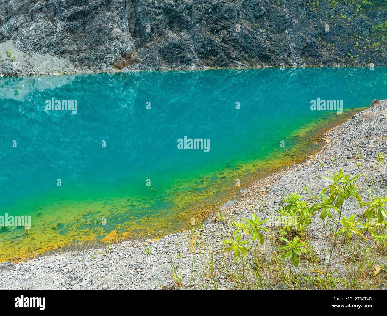 Aerial view beautiful The reflection of the blue sky in the emerald green pond. Emerald green ...