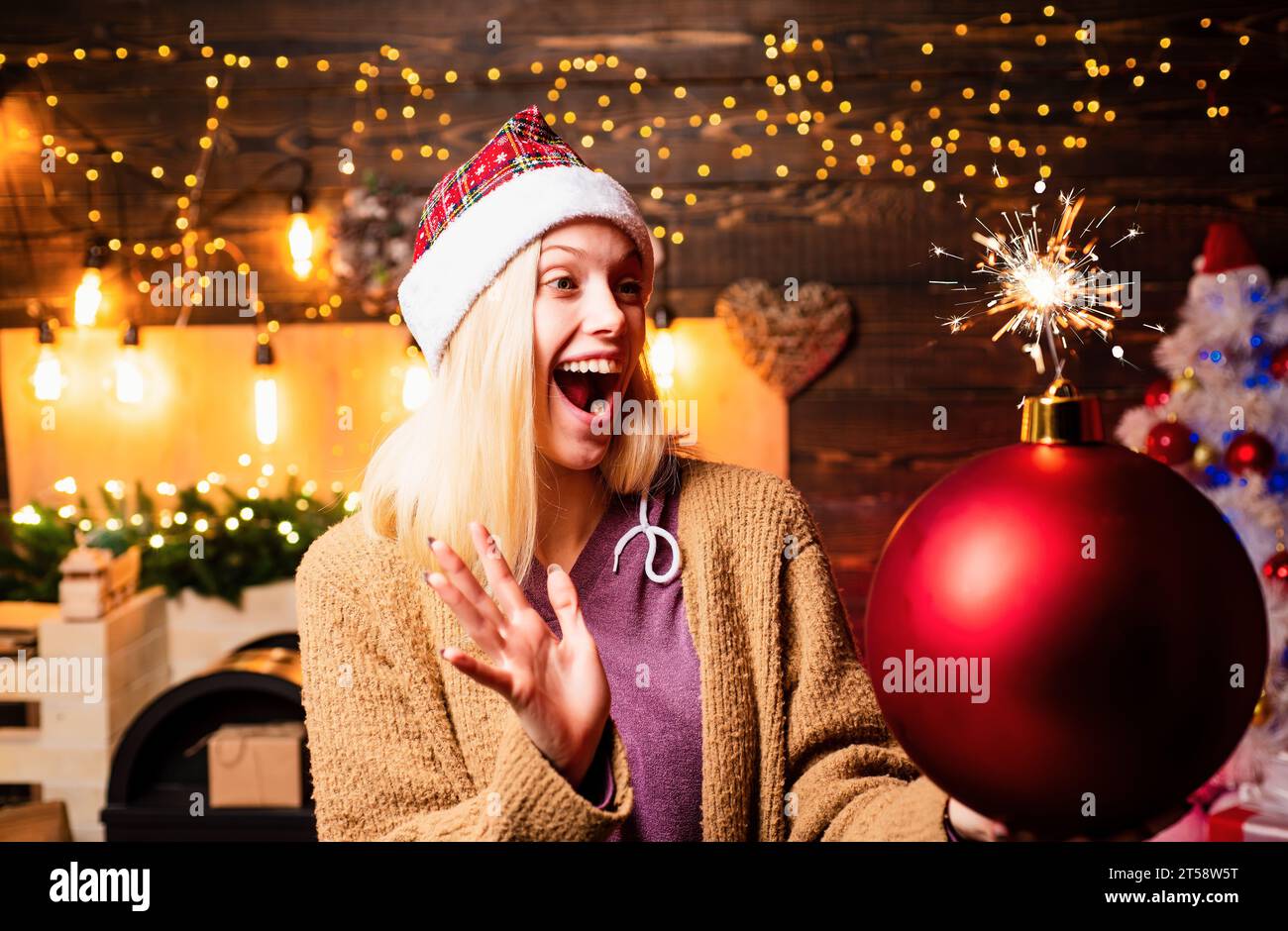 Christmas woman. Happy new year. Christmas woman hold bomb. Creative ...