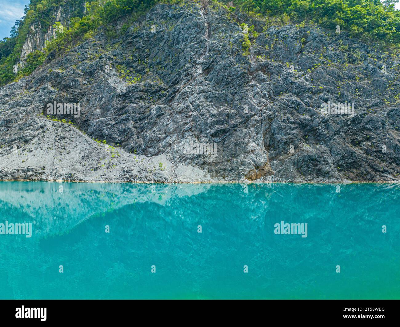 Aerial view beautiful The reflection of the blue sky in the emerald green pond. Emerald green ...