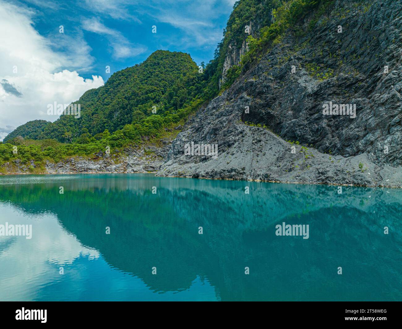 Aerial view beautiful The reflection of the blue sky in the emerald green pond. Emerald green ...
