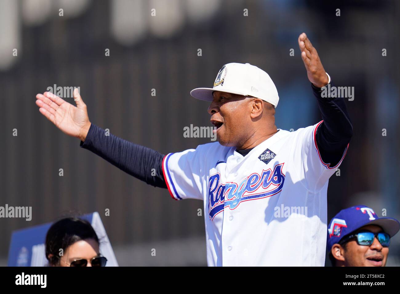 Texas Rangers third base coach Tony Beasley celebrates with fans during ...