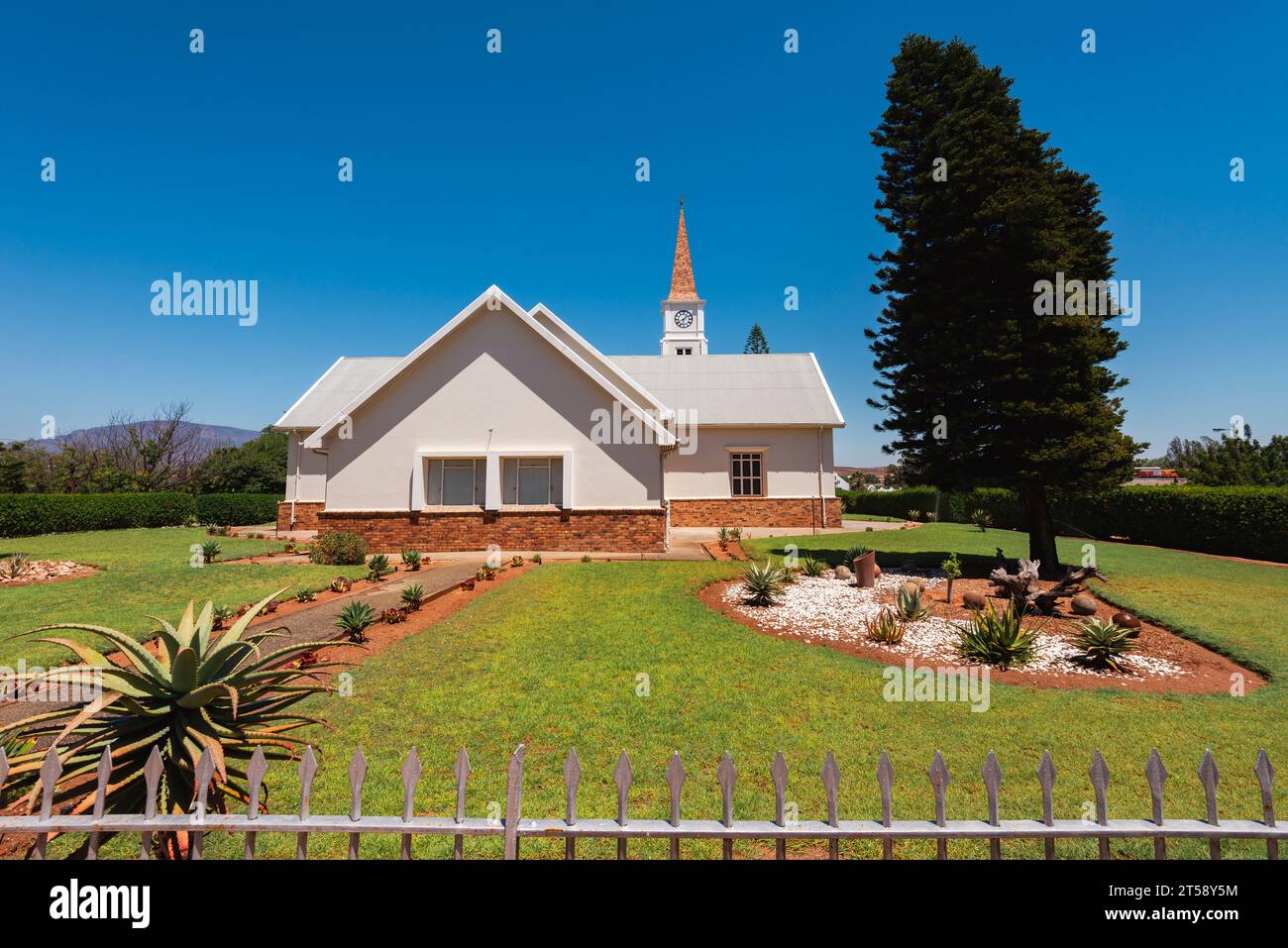 A beautiful church with an immaculate green lawn and garden in the ...