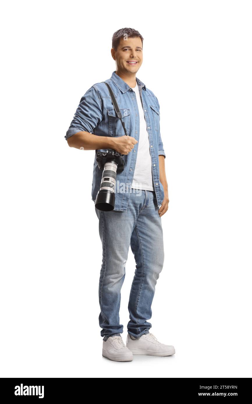 Full length portrait of a male photographer carrying a professional ...