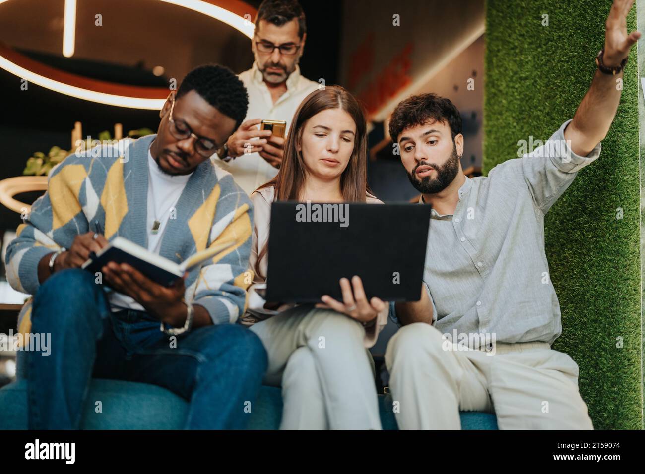 Downtown Work Hub: Multiracial Team Discussing Business Strategies for ...