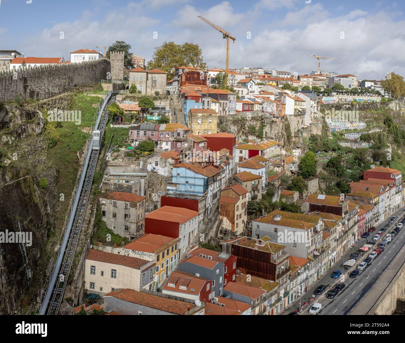 The Guindais Funicular running up a steep hill from the river Douro ...