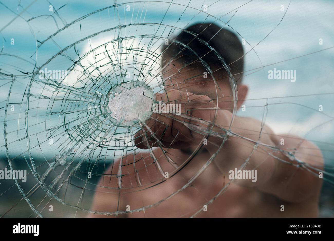 Ready to fight cracked glass. Fist punch. Man boxing, strength and ...