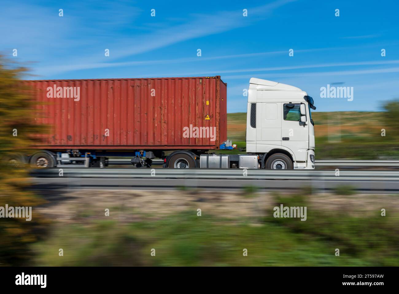 Truck transporting a container with a speed effect and the rest of the ...