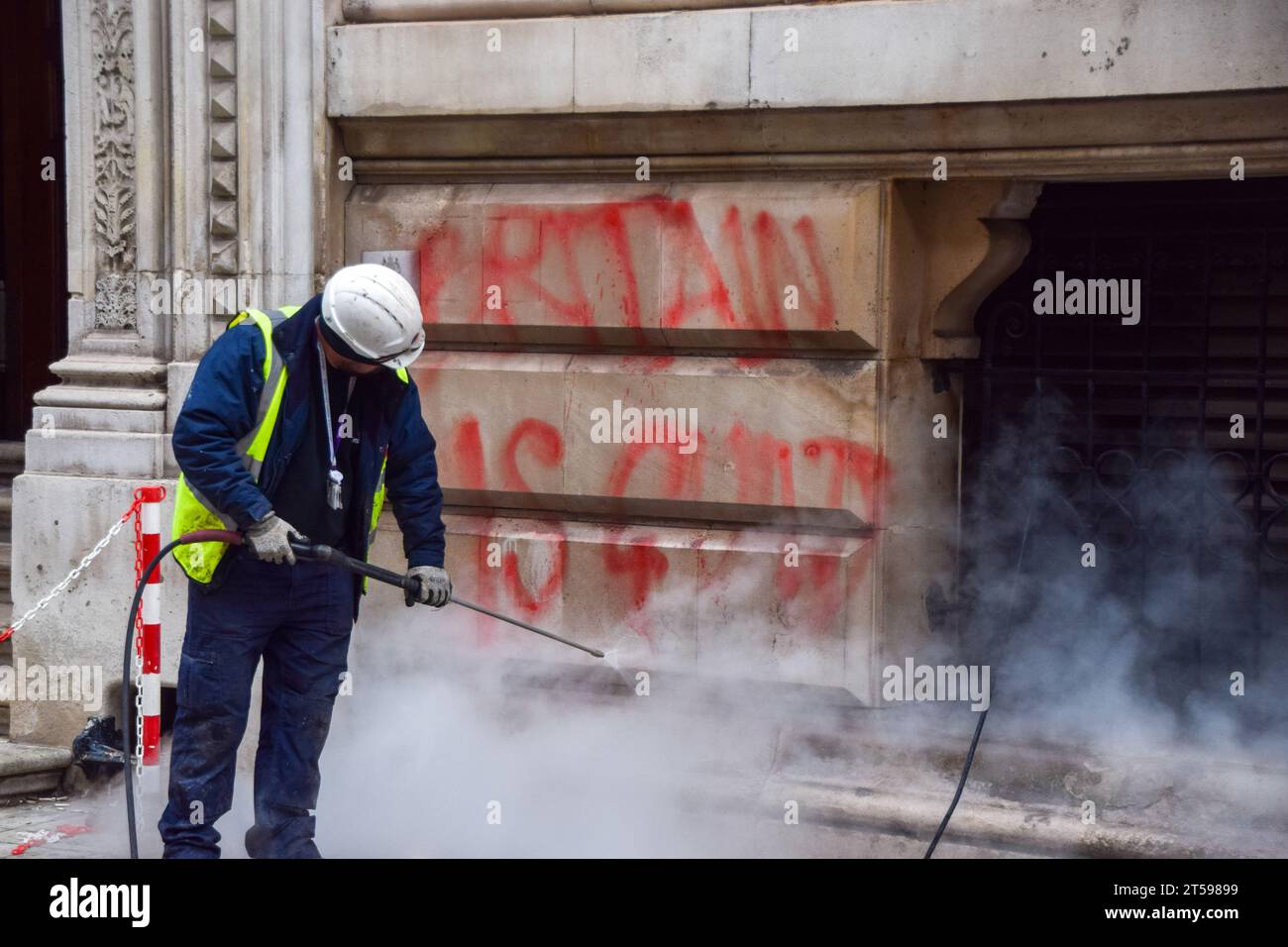 London, UK. 03rd Nov, 2023. A worker cleans the graffiti after pro ...