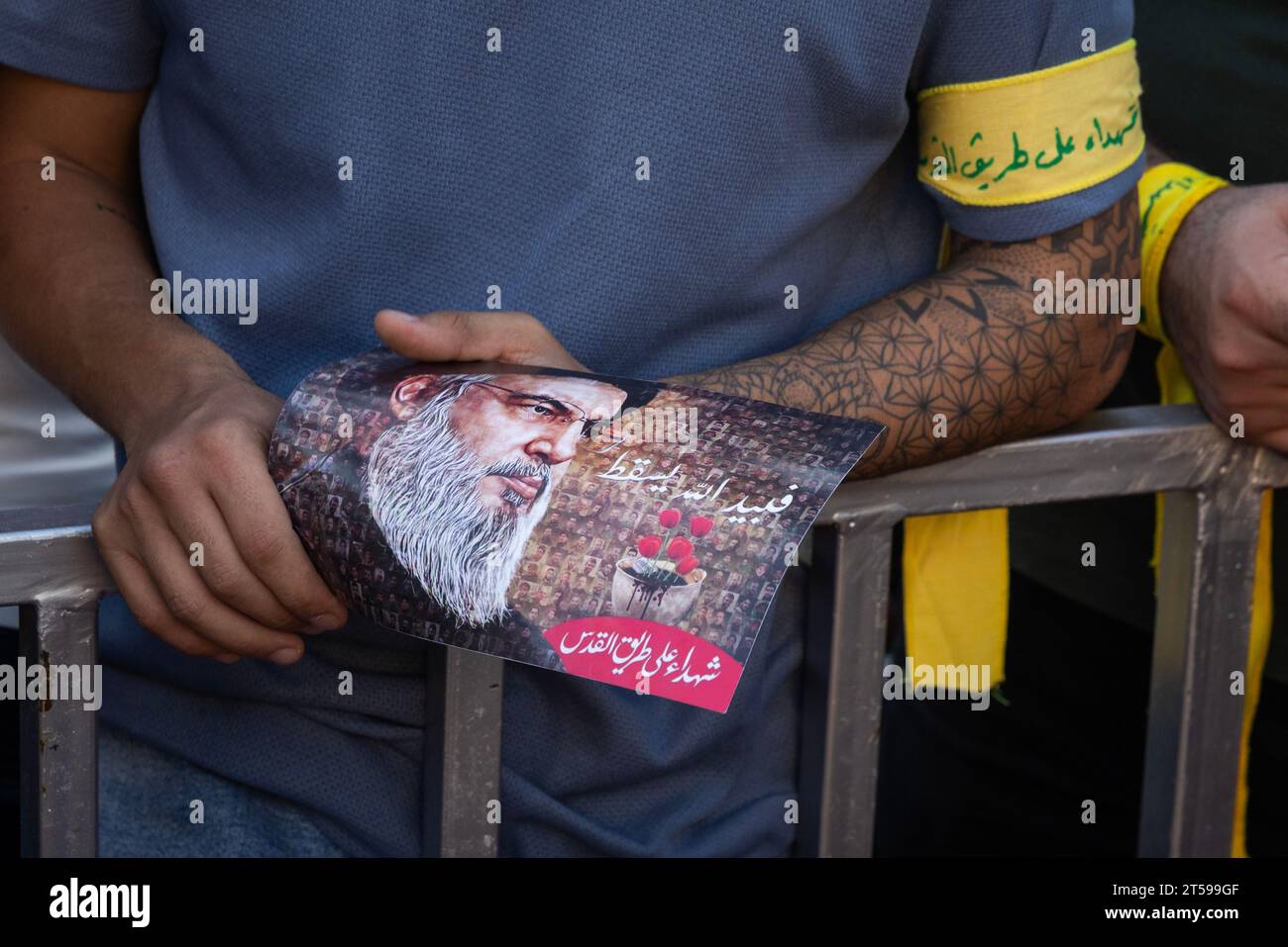Beirut, Lebanon. 3rd Nov, 2023. A man holds image of Hezbollah ...