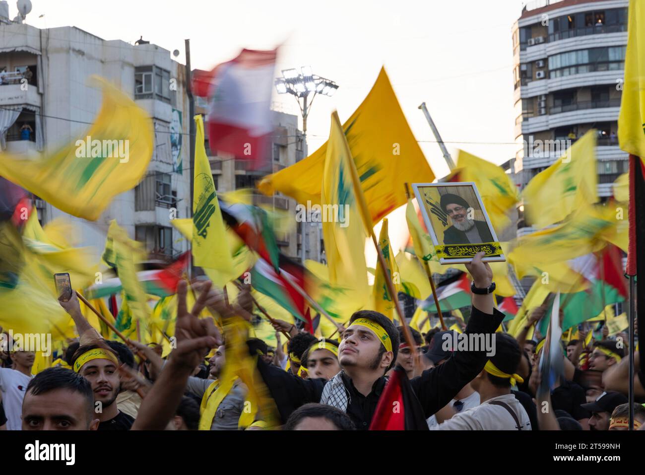 Beirut, Lebanon. 3rd Nov, 2023. A man holds a picture of Hezbollah ...