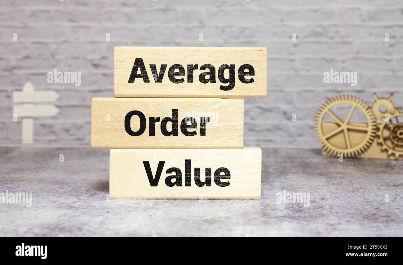 AVERAGE ORDER VALUE. Black marker on torn cardboard background Stock ...