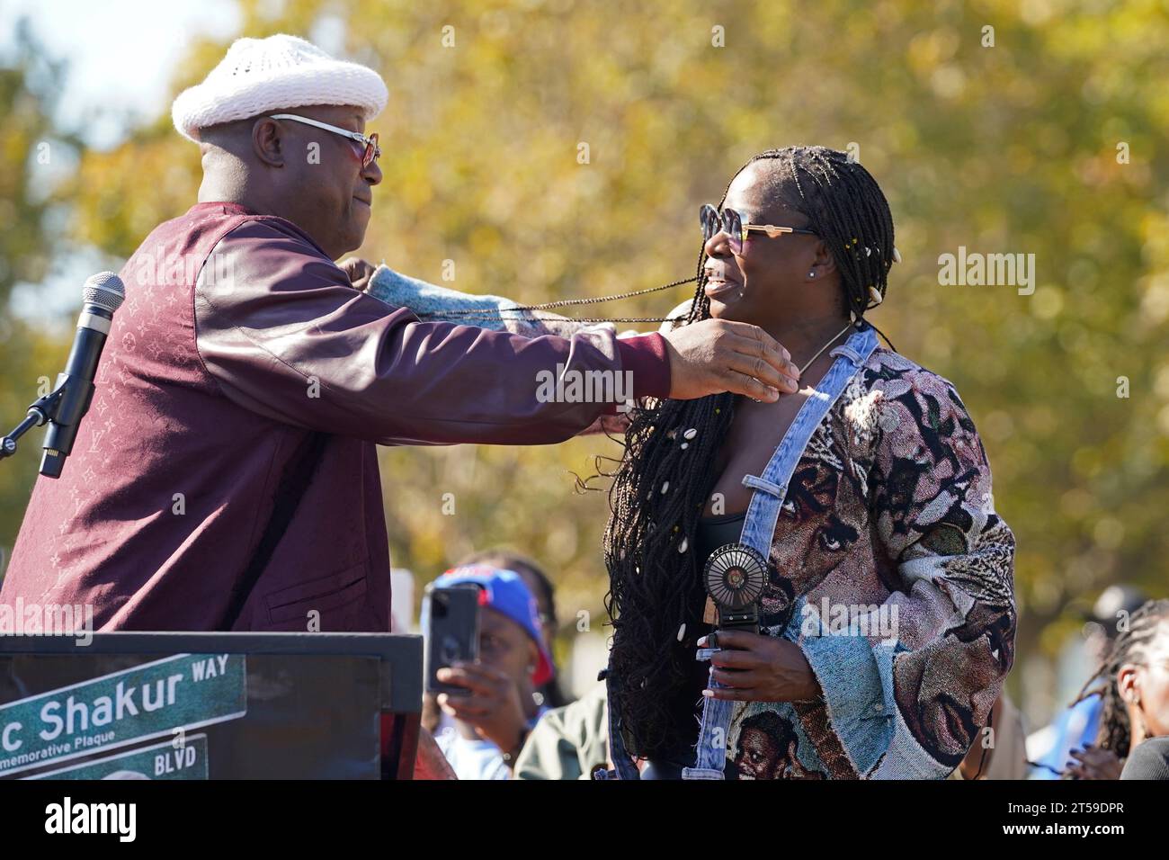 Sekyiwa Shakur, sister of Tupac Shakur, is embraced by E-40 during a ...