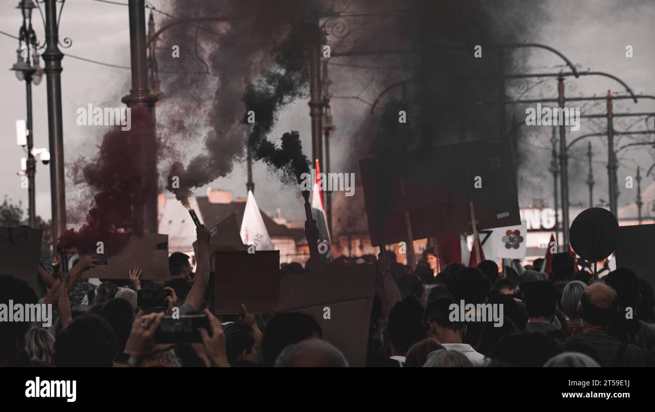A large crowd of protesters with banners on the streets of Budapest ...
