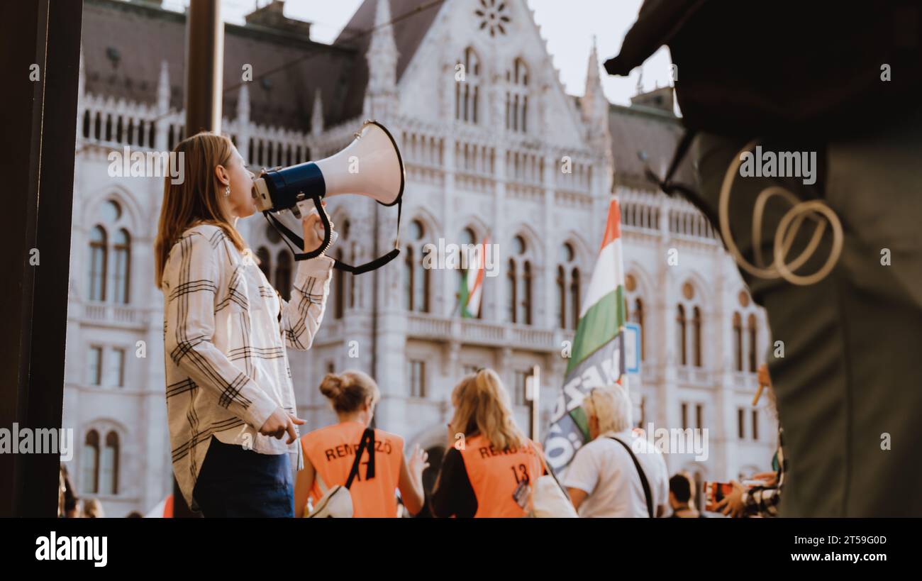A large crowd of protesters with banners on the streets of Budapest ...