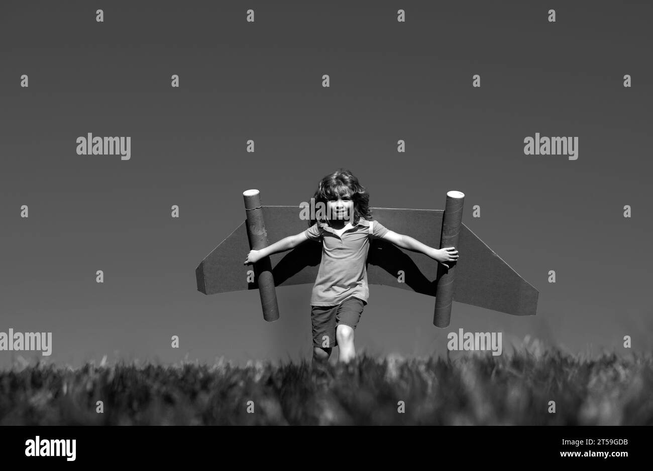 Kid with jet pack superhero. Child pilot against summer sky background ...