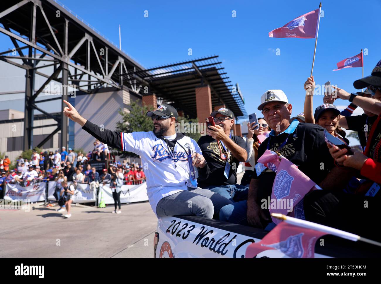 Texas Rangers pitcher Martin Perez waves to fans during a parade for ...