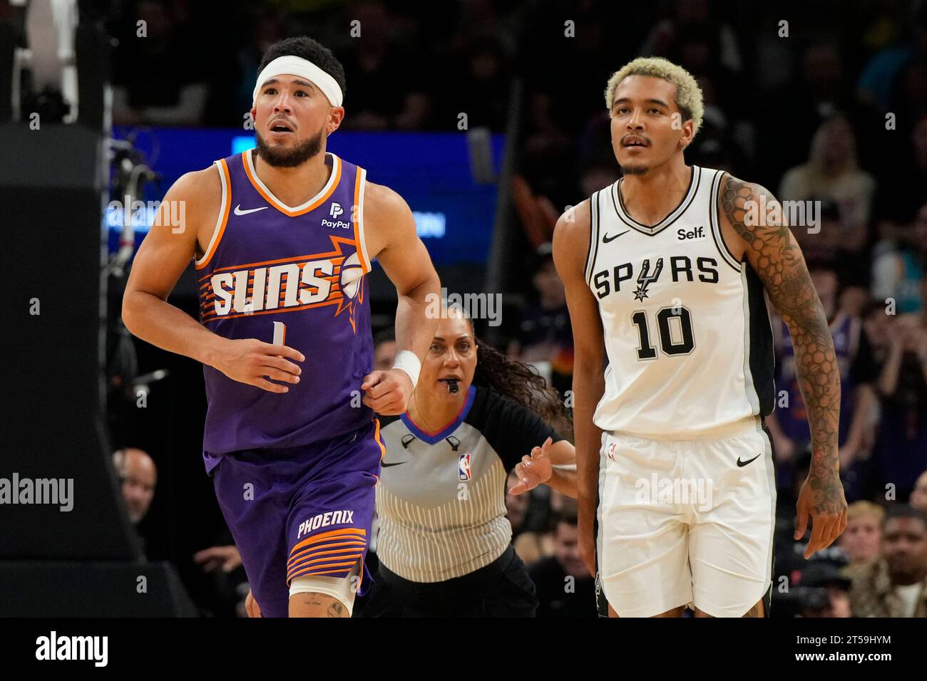 Phoenix Suns guard Devin Booker (1) and San Antonio Spurs forward ...
