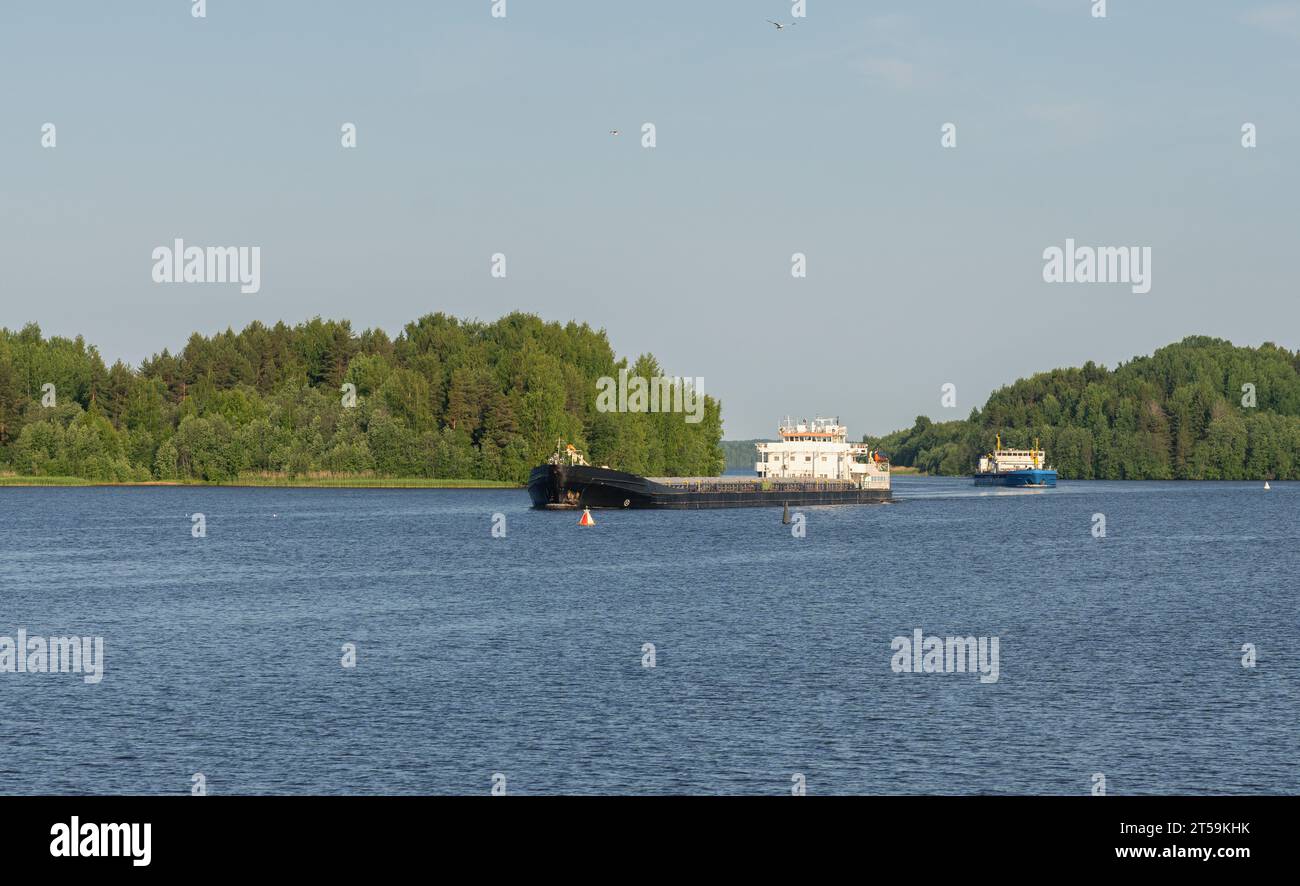 A barge is sailing on the Volga River Stock Photo - Alamy