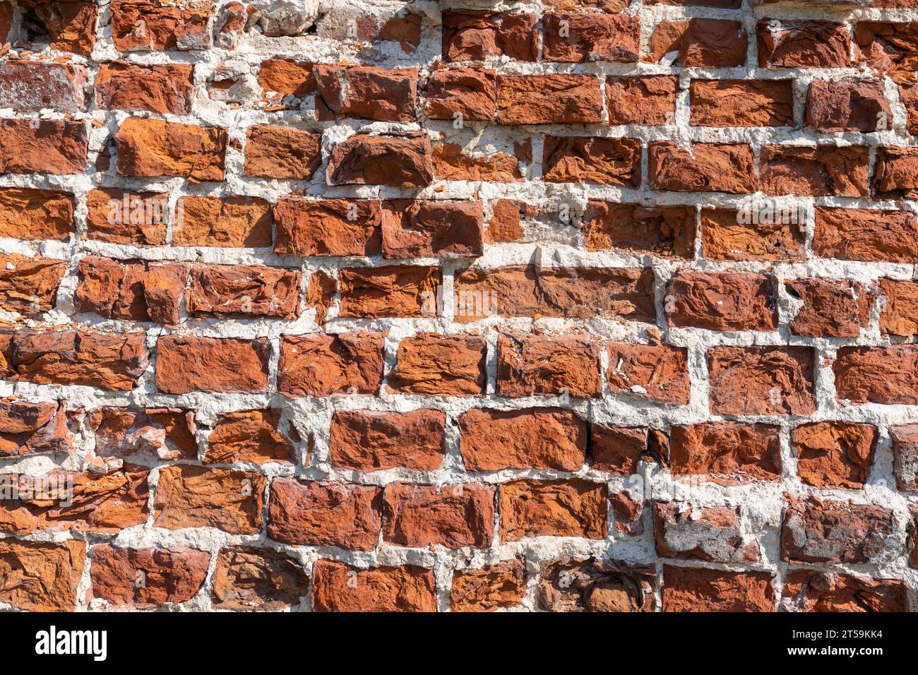 Background, texture of an old wall of crushed red brick Stock Photo - Alamy
