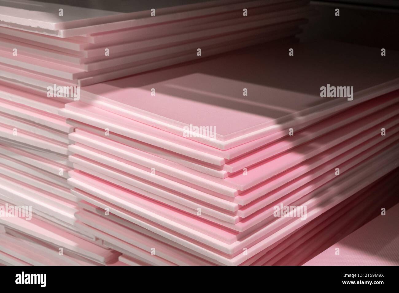 Pink Extruded Polystyrene foam thermal insulation boards stacked in the ...