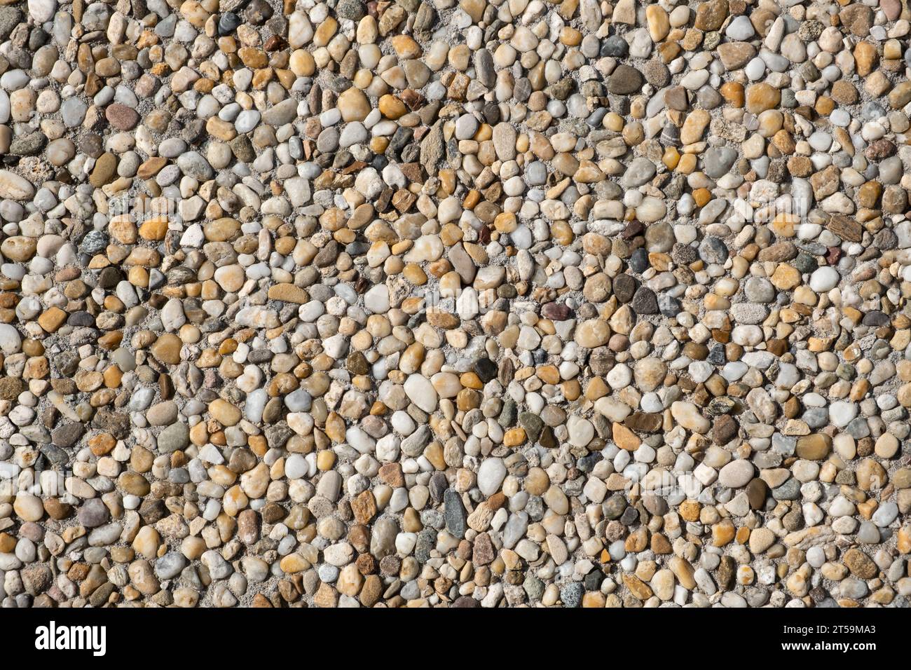 full-frame texture showcases the surface of granulite, displaying small ...