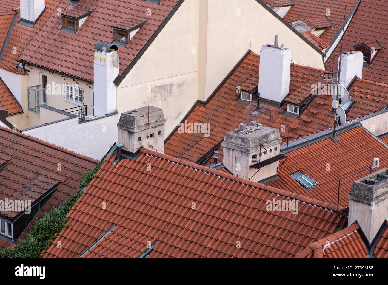 picturesque view of the old town in Prague, featuring rooftops with ...