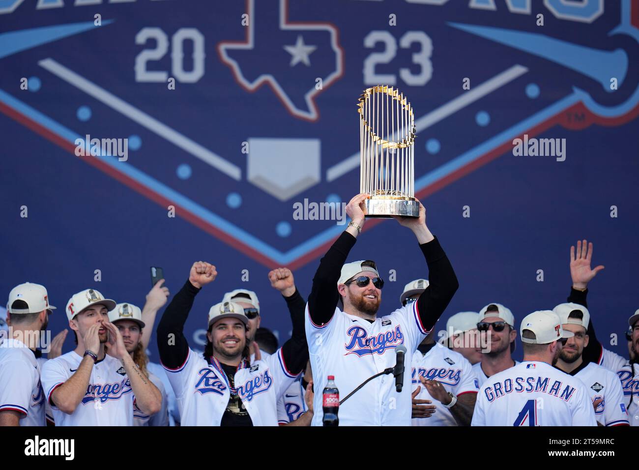 Texas Rangers starting pitcher Jordan Montgomery holds the Commissioner's Trophy as he ...