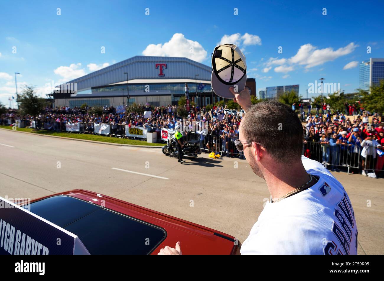 Texas Rangers designated hitter Mitch Garver tips his cap to fans ...